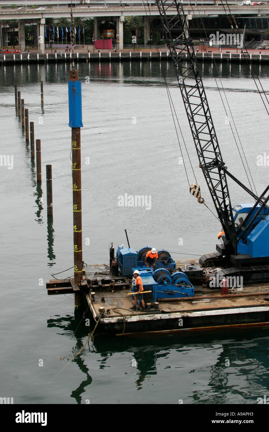 Pile driving work in a marina at Darling harbor in Sydney Stock Photo ...