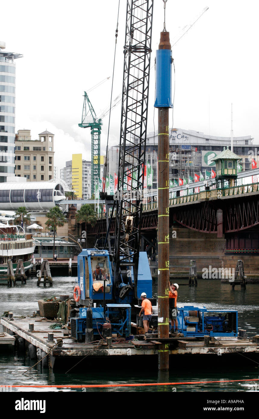 Pile driving work in a marina at Darling harbour in Sydney Stock Photo ...