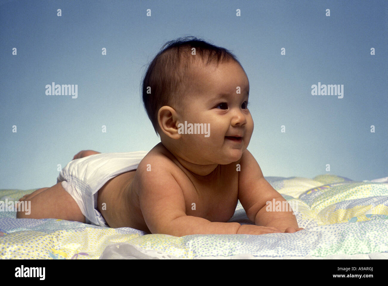 Girl laying on her stomach hi-res stock photography and images - Alamy