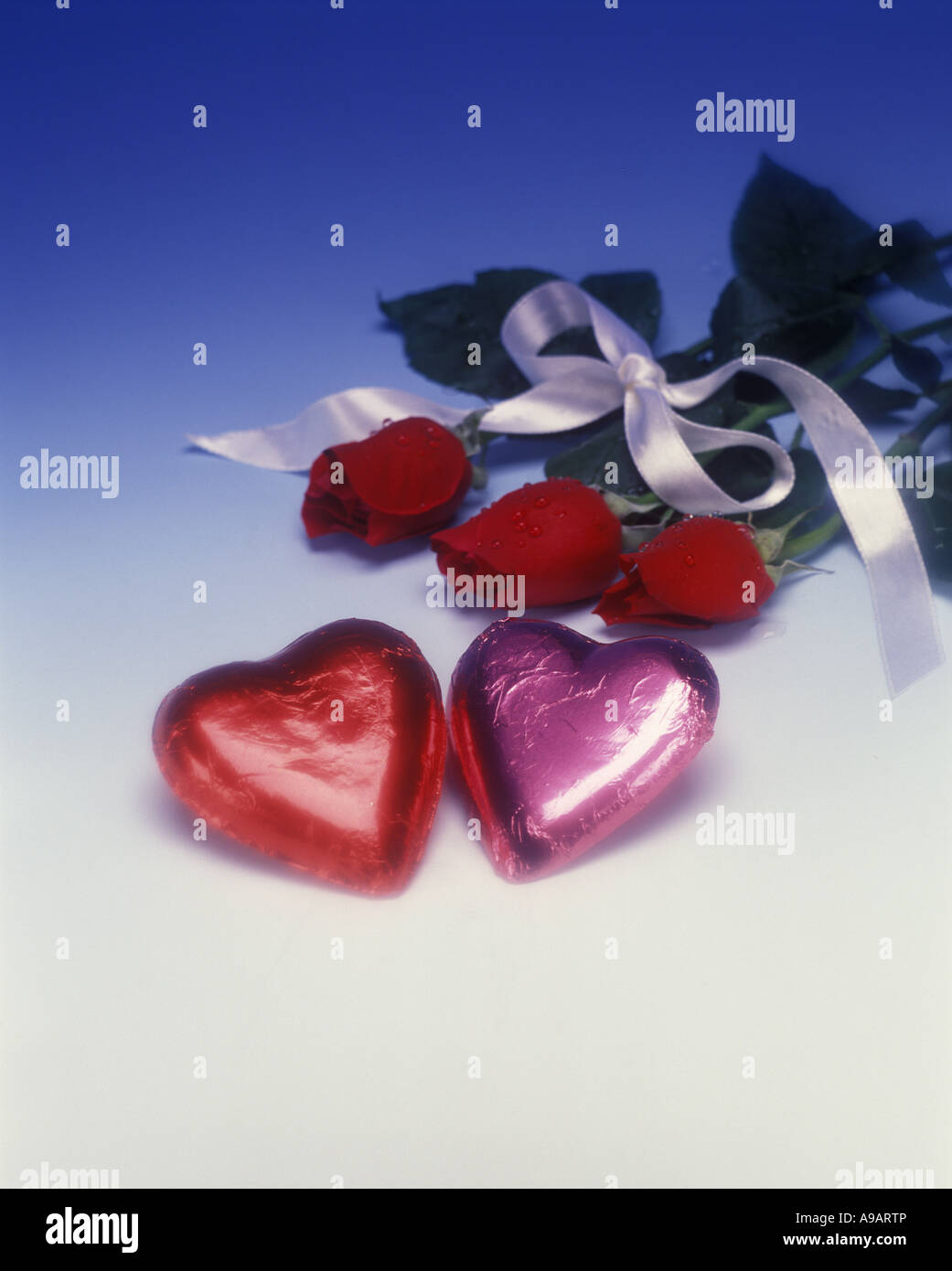 SAINT VALENTINE DAY RED ROSES WITH CHOCOLATE HEARTS Stock Photo - Alamy