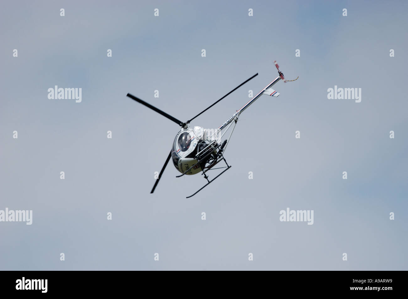 Helicopter flying overhead Stock Photo - Alamy