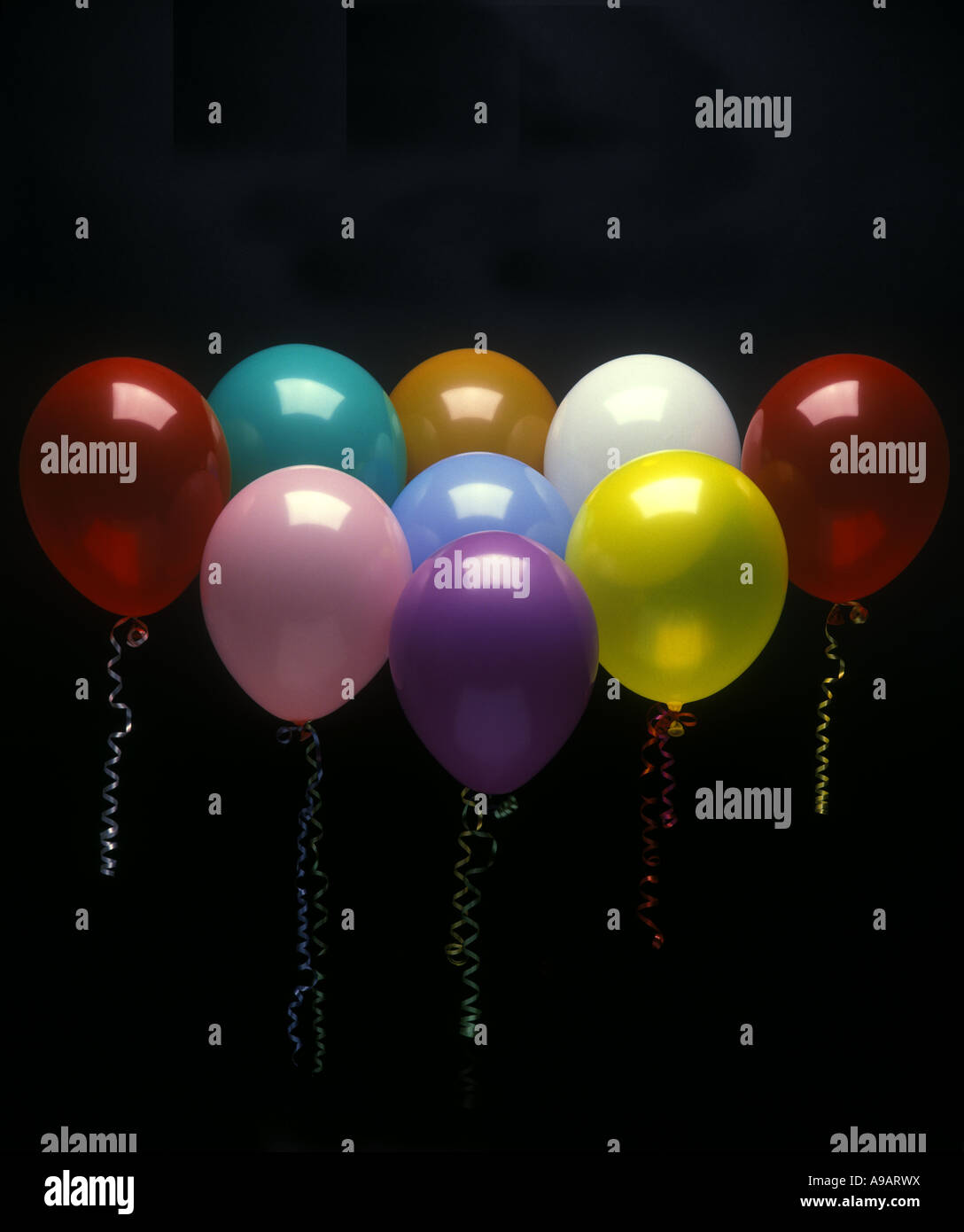 GROUP OF PARTY BALLOONS ON BLACK BACKGROUND Stock Photo - Alamy