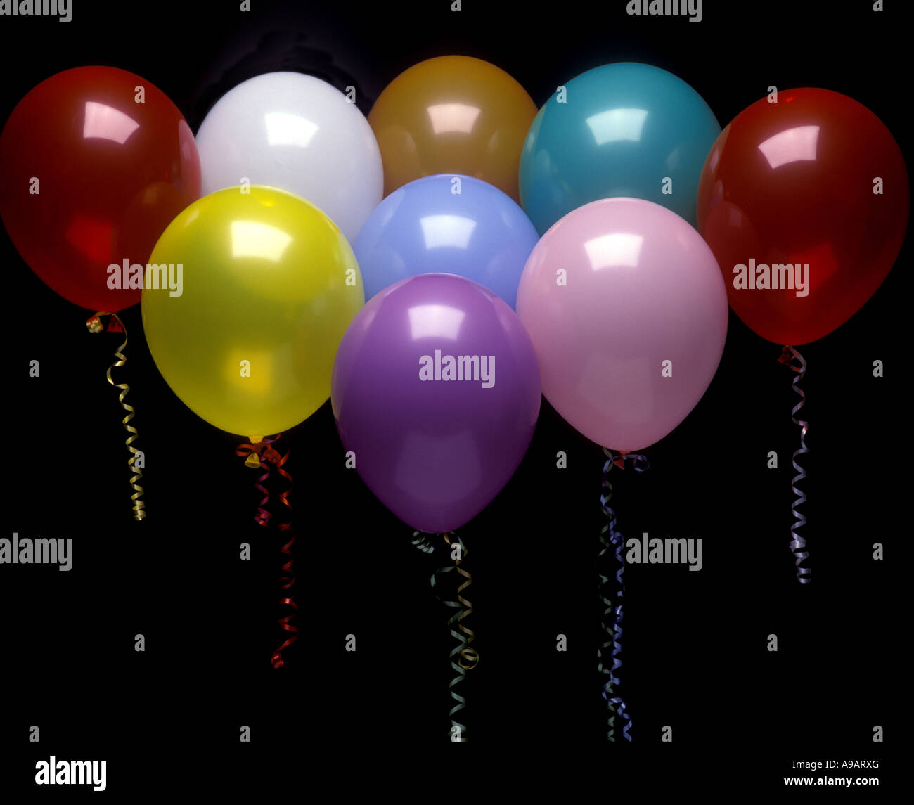 GROUP OF PARTY BALLOONS ON BLACK BACKGROUND Stock Photo - Alamy