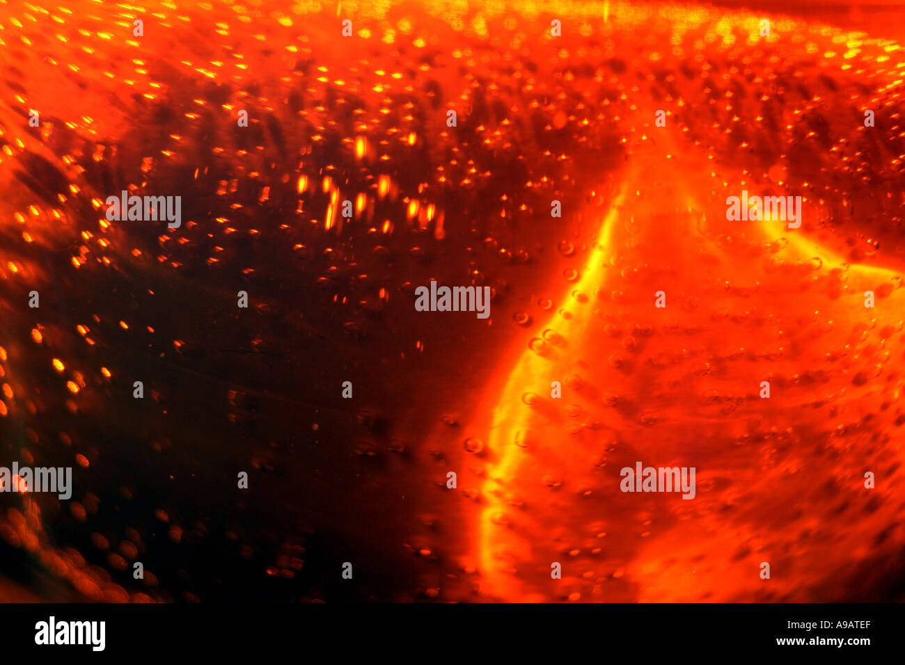 Bubbles in Orange Fluid Stock Photo - Alamy