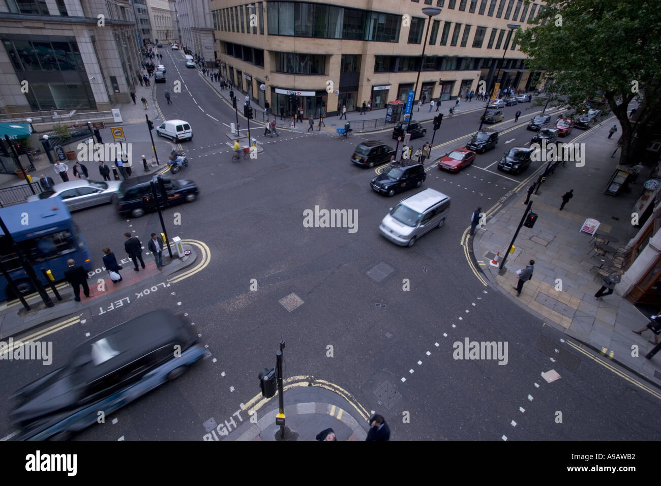 Crossroad with London traffic and pedestrians commuters central London ...