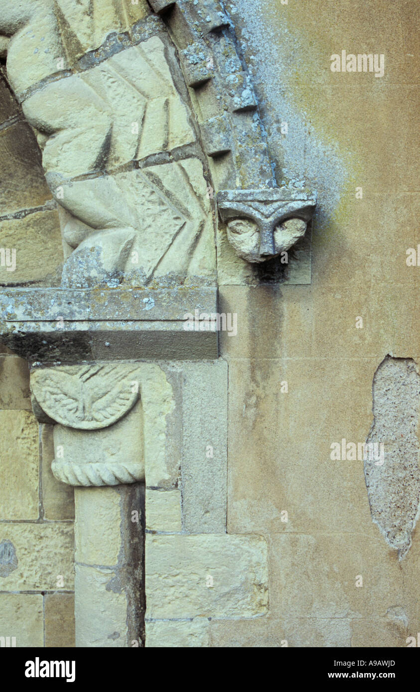 Detail of part of a carved stone Saxon arch with pillar and crumbling ...