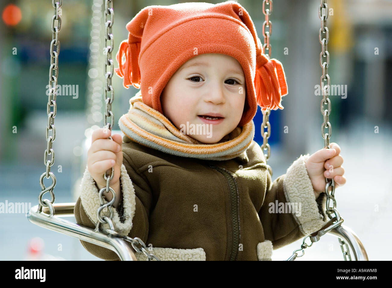 BOY ENJOYEMENT ON CARNIVAL SWING RIDE PARK Stock Photo - Alamy