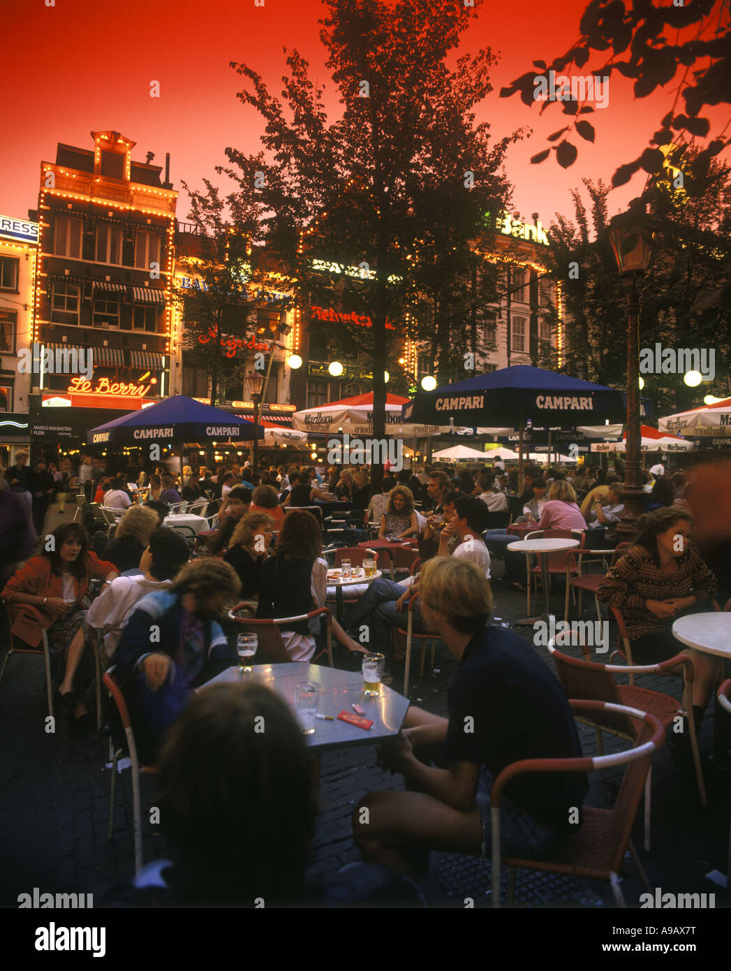 PEOPLE SITTING AT TABLES OUTDOOR CAFES LEIDSE PLEIN AMSTERDAM HOLLAND ...