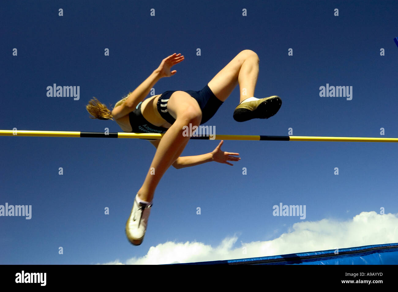 teenage girl high jumping Stock Photo - Alamy