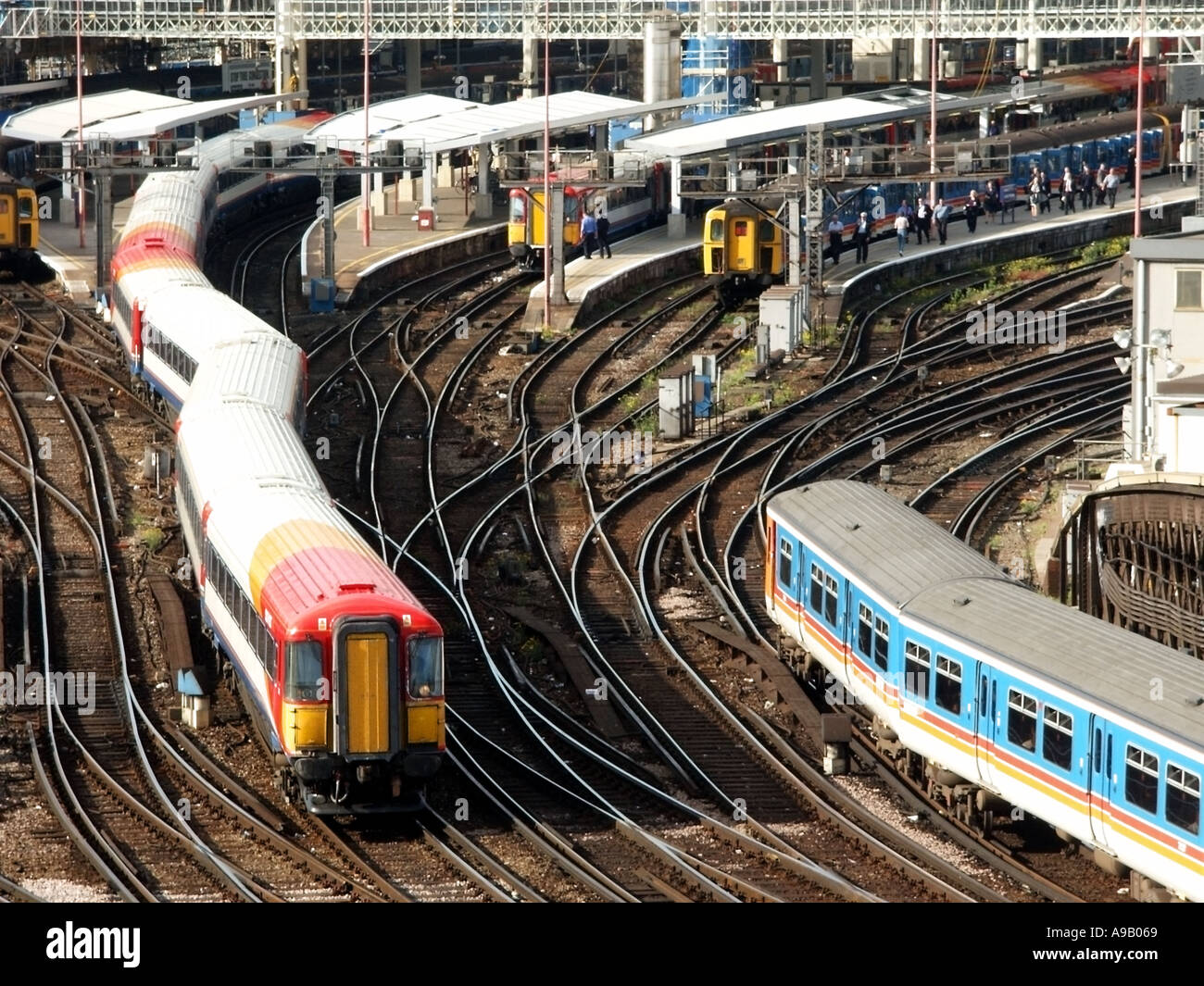 South West trains yellow and red front passenger service departs ...