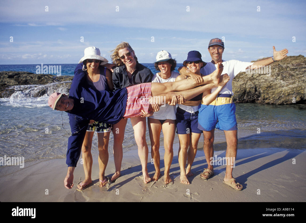 Australia Queensland group of friends having fun on beach Stock Photo ...
