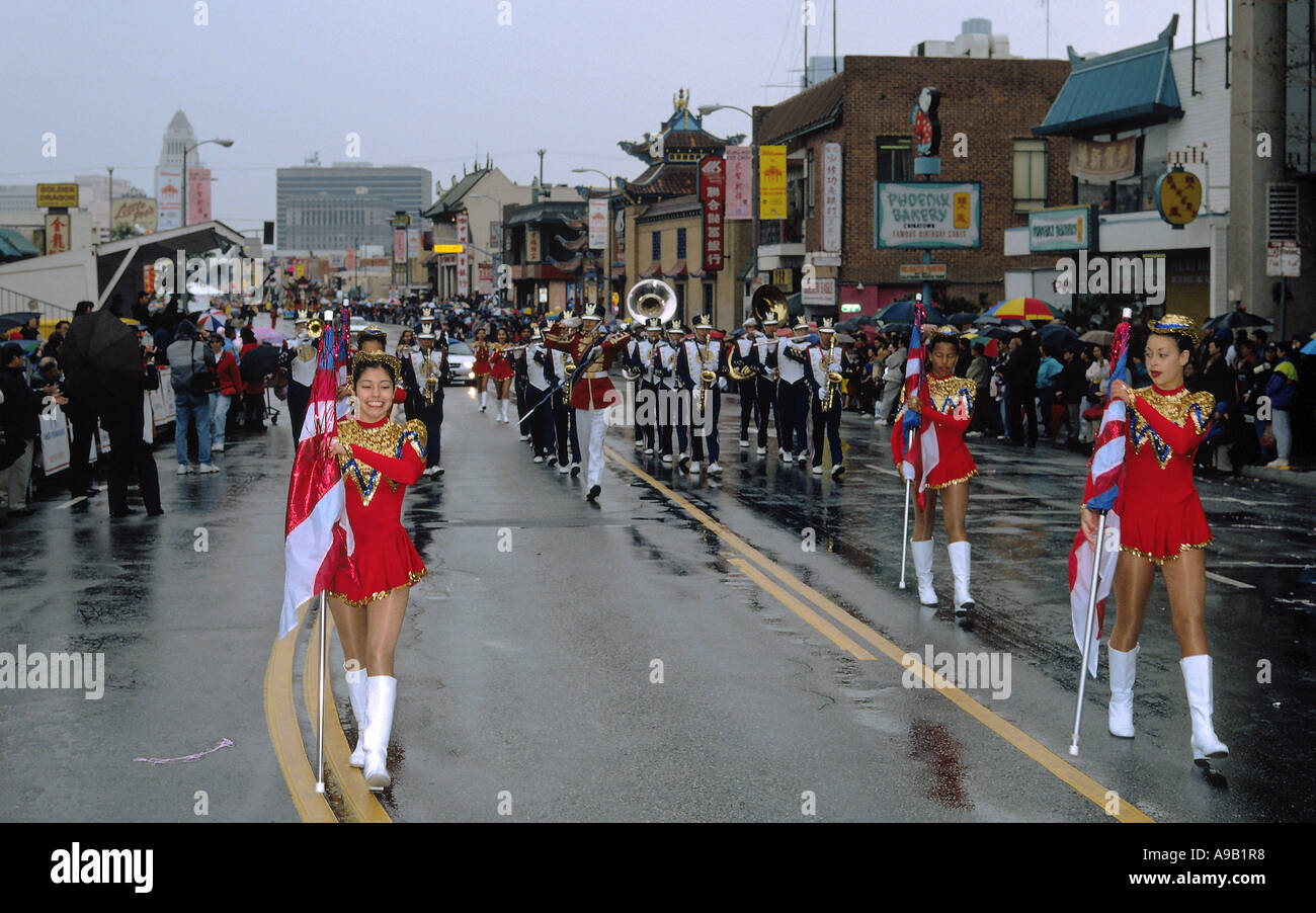 Marching in the rain are these young girls participating in the Chinese ...