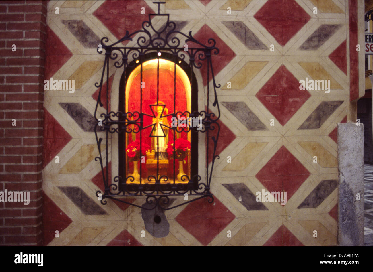Devotion To Catholic Saint inset into wall in Marbella Stock Photo - Alamy