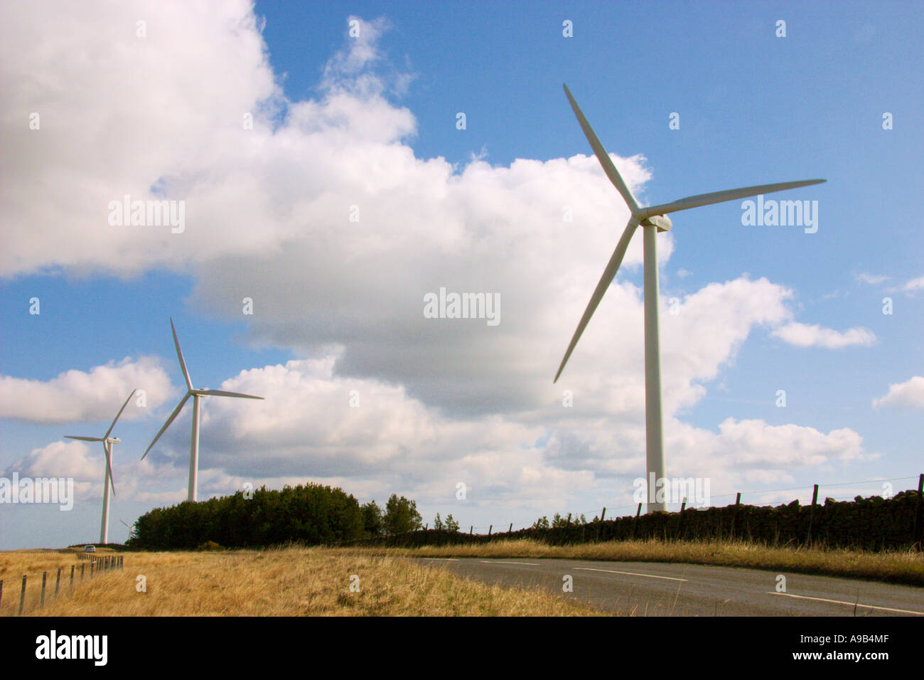 Wind farm in countryside with blue sky and clouds Stock Photo - Alamy