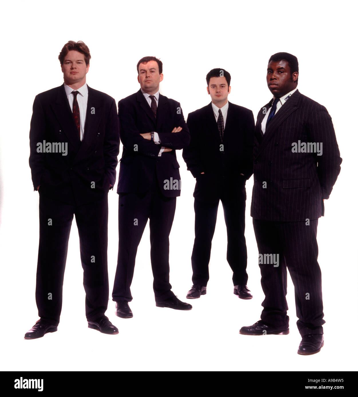 4 serious men in suits Stock Photo - Alamy