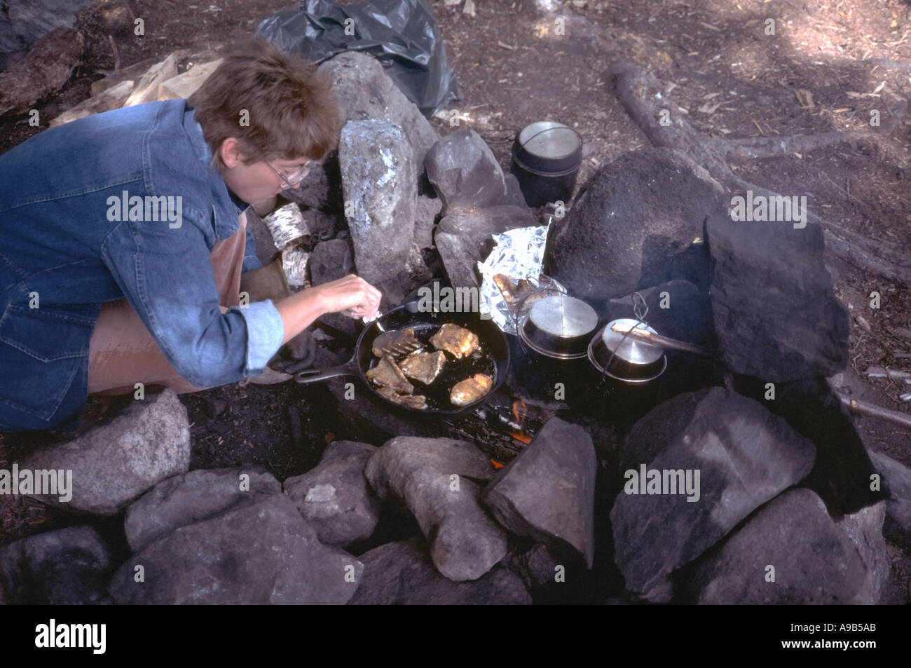 Cooking over fire Stock Photo - Alamy