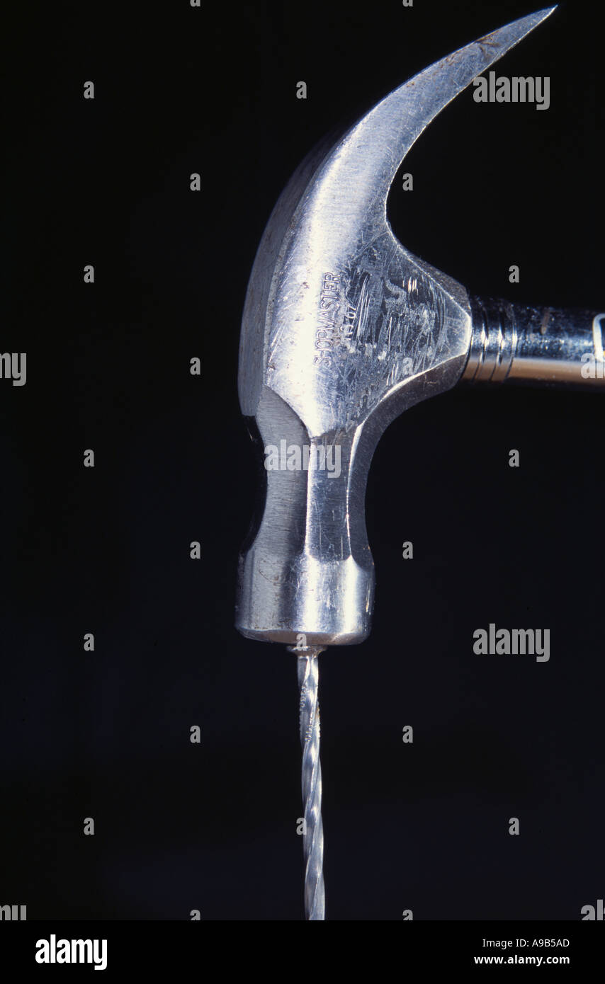 Hammer hitting nail Stock Photo - Alamy