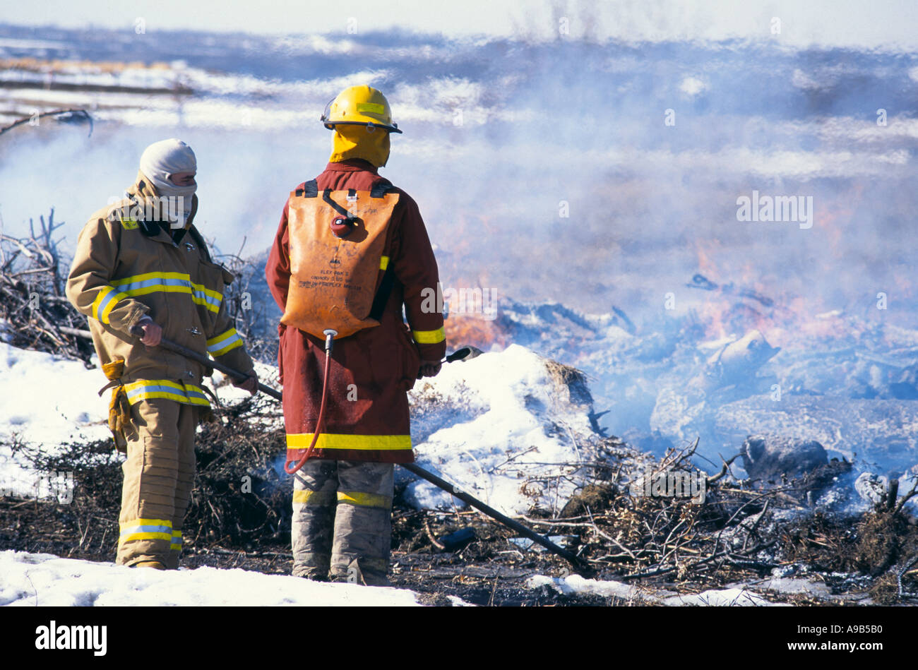 Volunteer Fire fighters and fire Stock Photo - Alamy