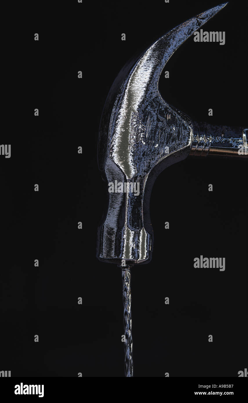 Hammer hitting nail Stock Photo - Alamy