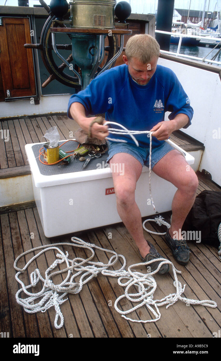 The bosun splicing ropes aboard the 1971 British brig Royalist Stock ...
