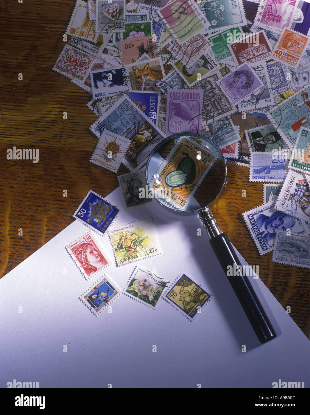 POSTAGE STAMPS WITH MAGNIFYING GLASS Stock Photo - Alamy