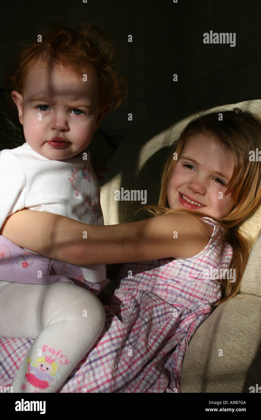 "Sisters Eva and Fifi pose for portraits Stock Photo - Alamy