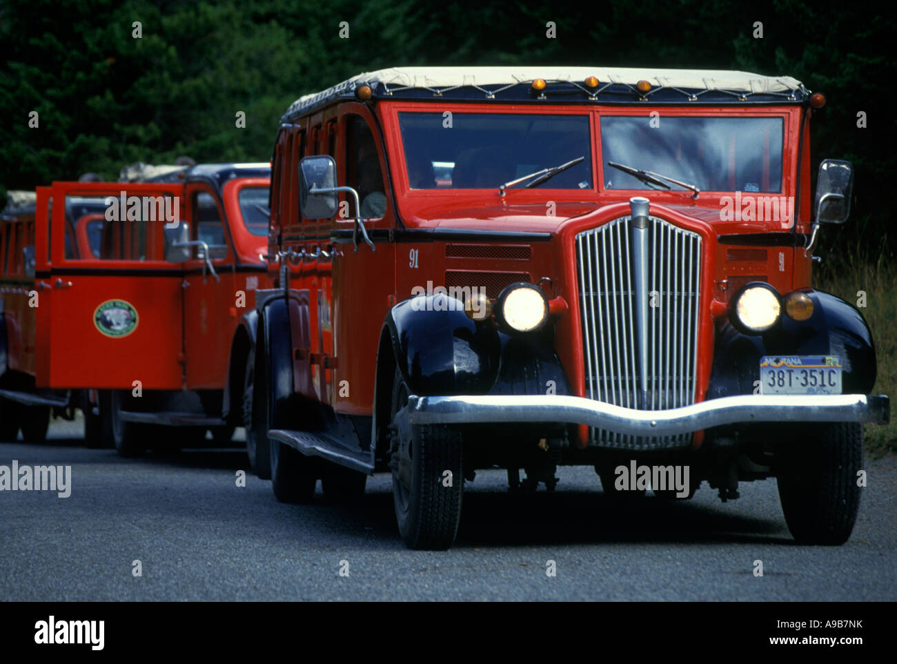 RED SIGHTSEEING EXCURSION TOUR BUSES GLACIER NATIONAL PARK MONTANA USA ...