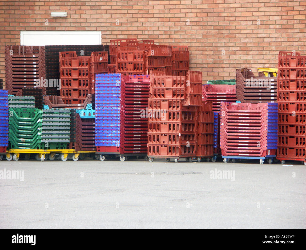 Plastic trays stacked outside a supermarket 2 Stock Photo - Alamy
