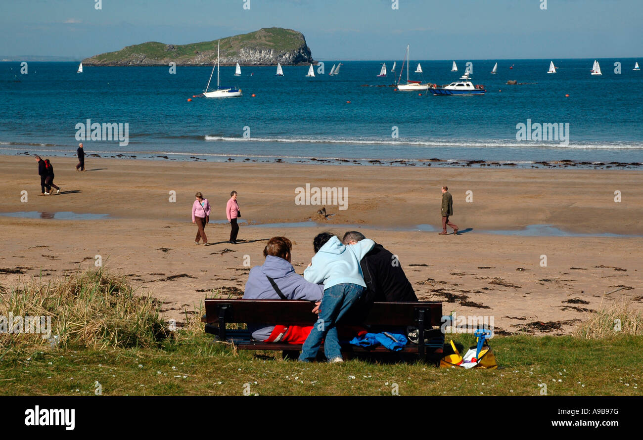 Family on bench looking at Craig Island,Firth of Forth from West Bay ...