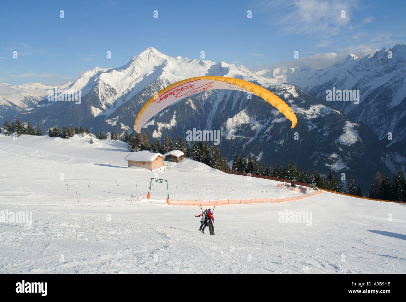 A tandem paraglider prepares to take off from Mayrhofen in the Austrian ...