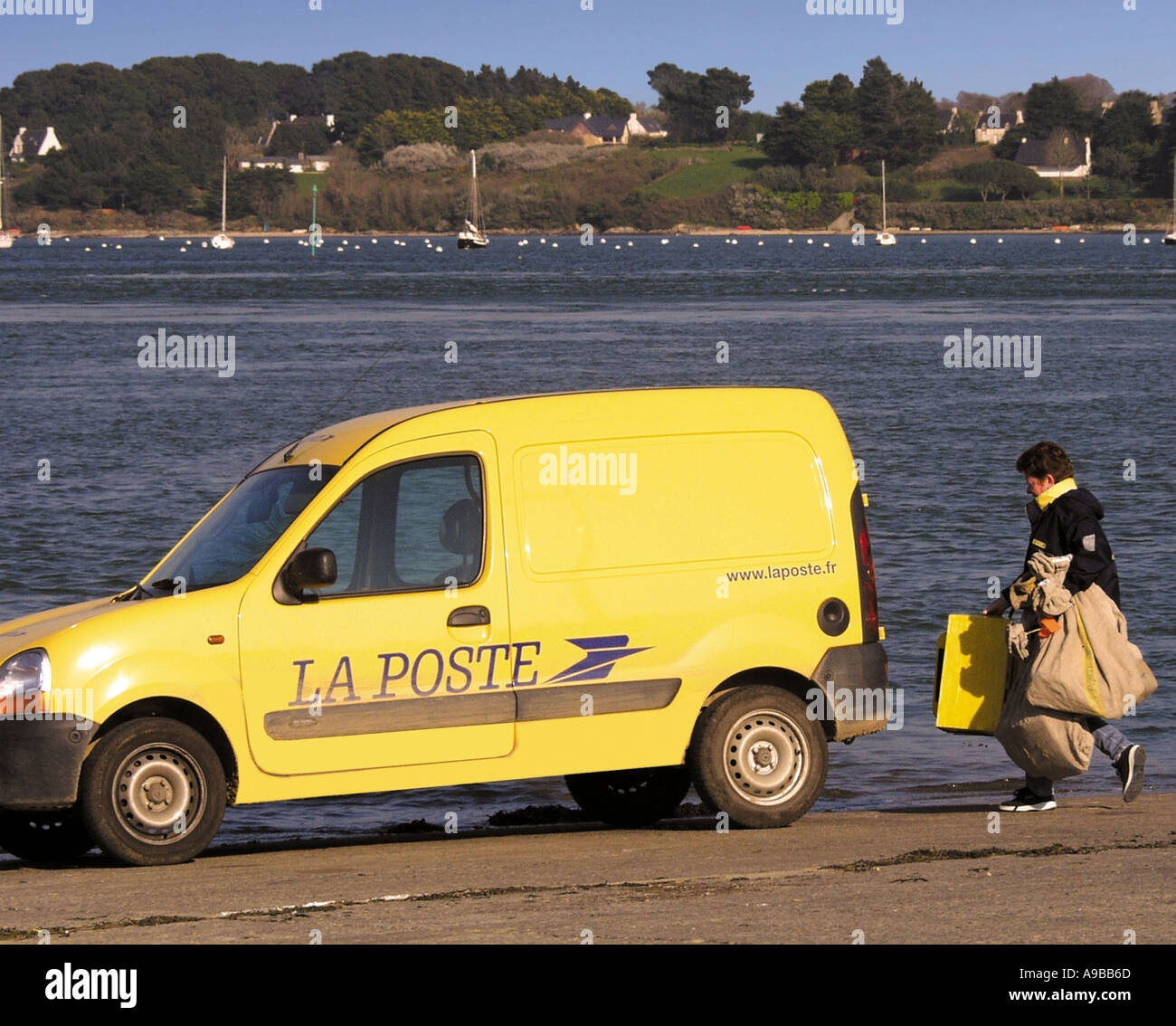france brittany golfe du morbihan bono woman loading post office van ...