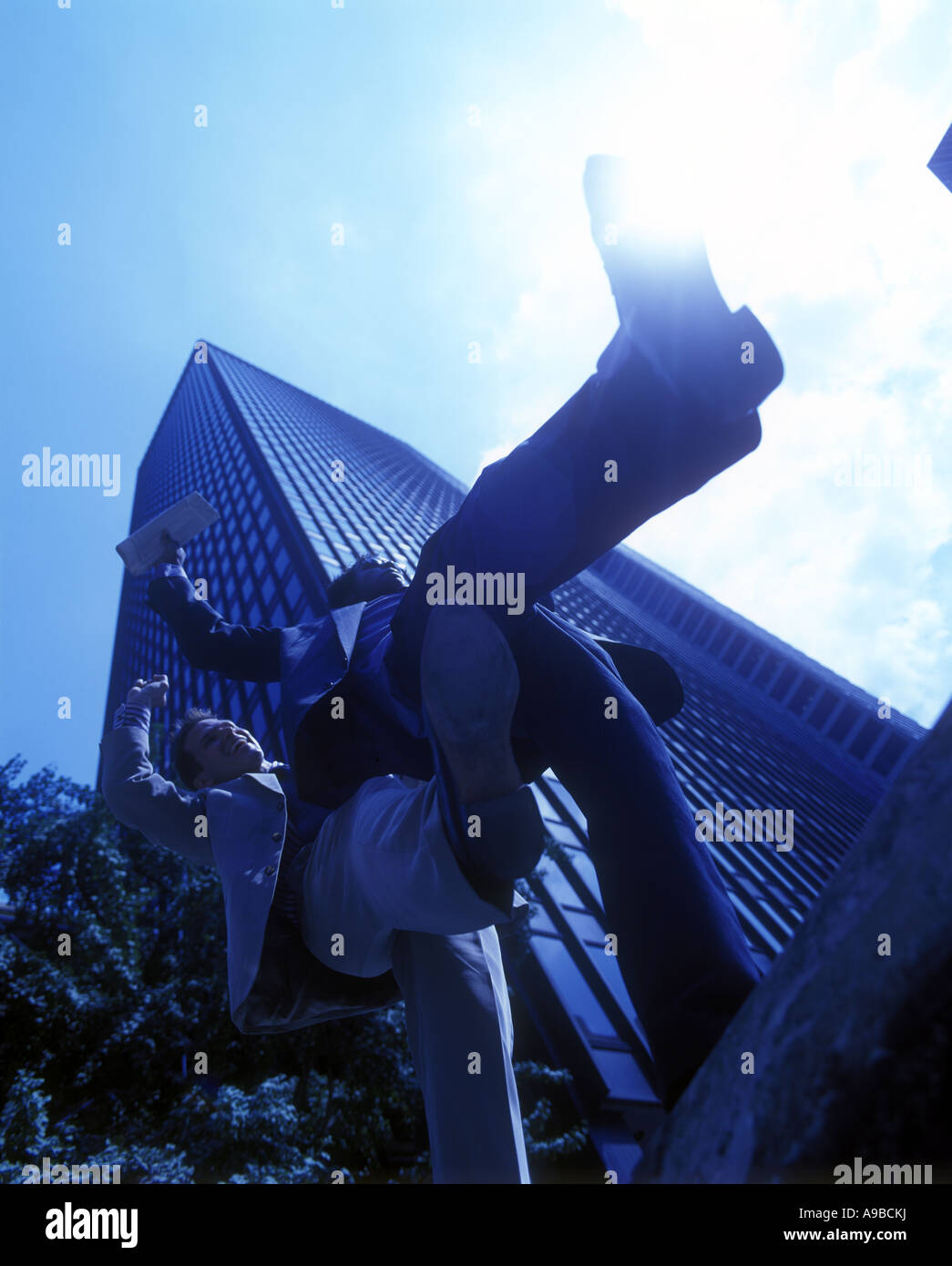 OFFICE WORKERS DANCING BY TALL OFFICE BUILDING Stock Photo - Alamy