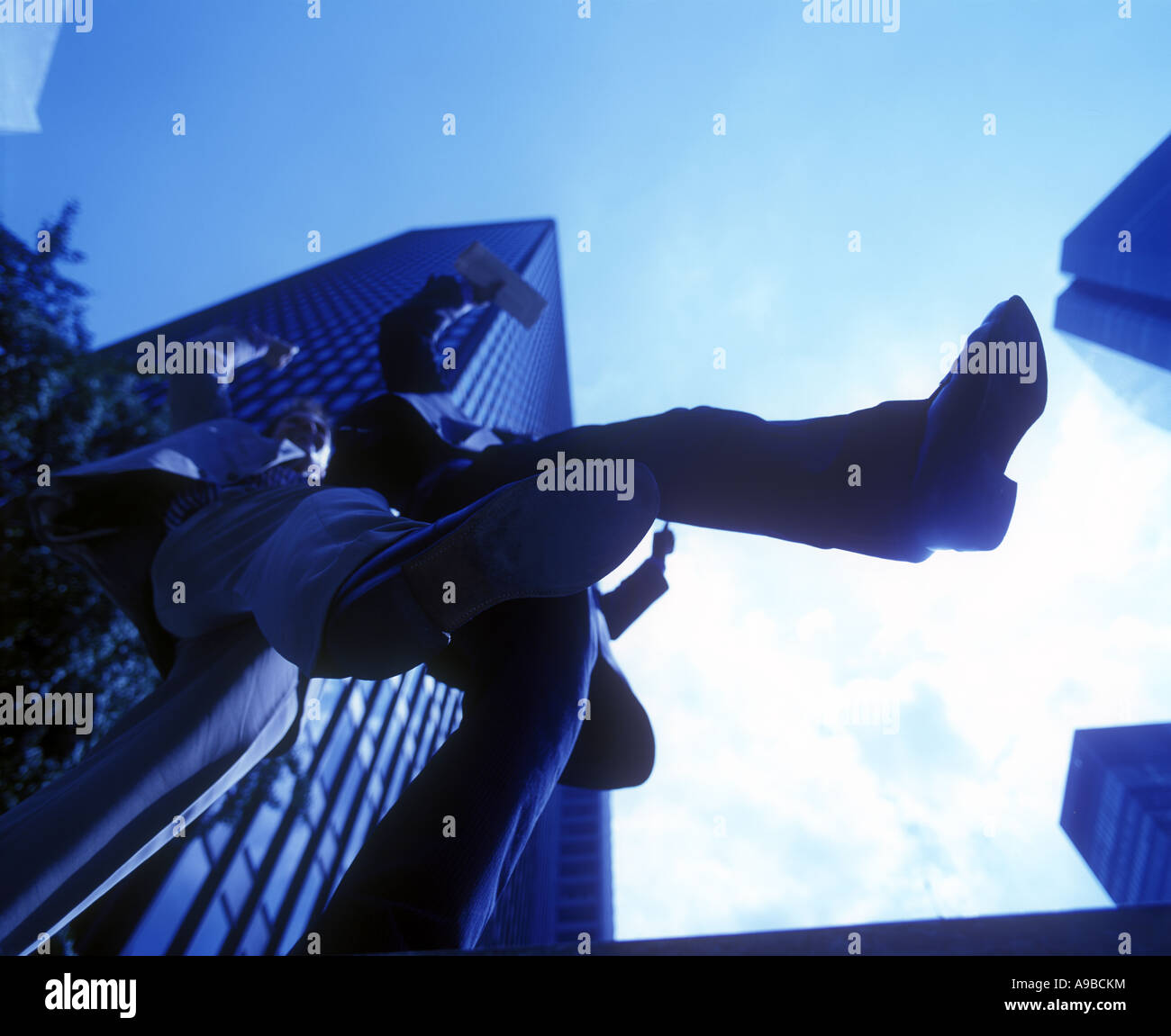 OFFICE WORKERS DANCING BY TALL OFFICE BUILDING Stock Photo - Alamy