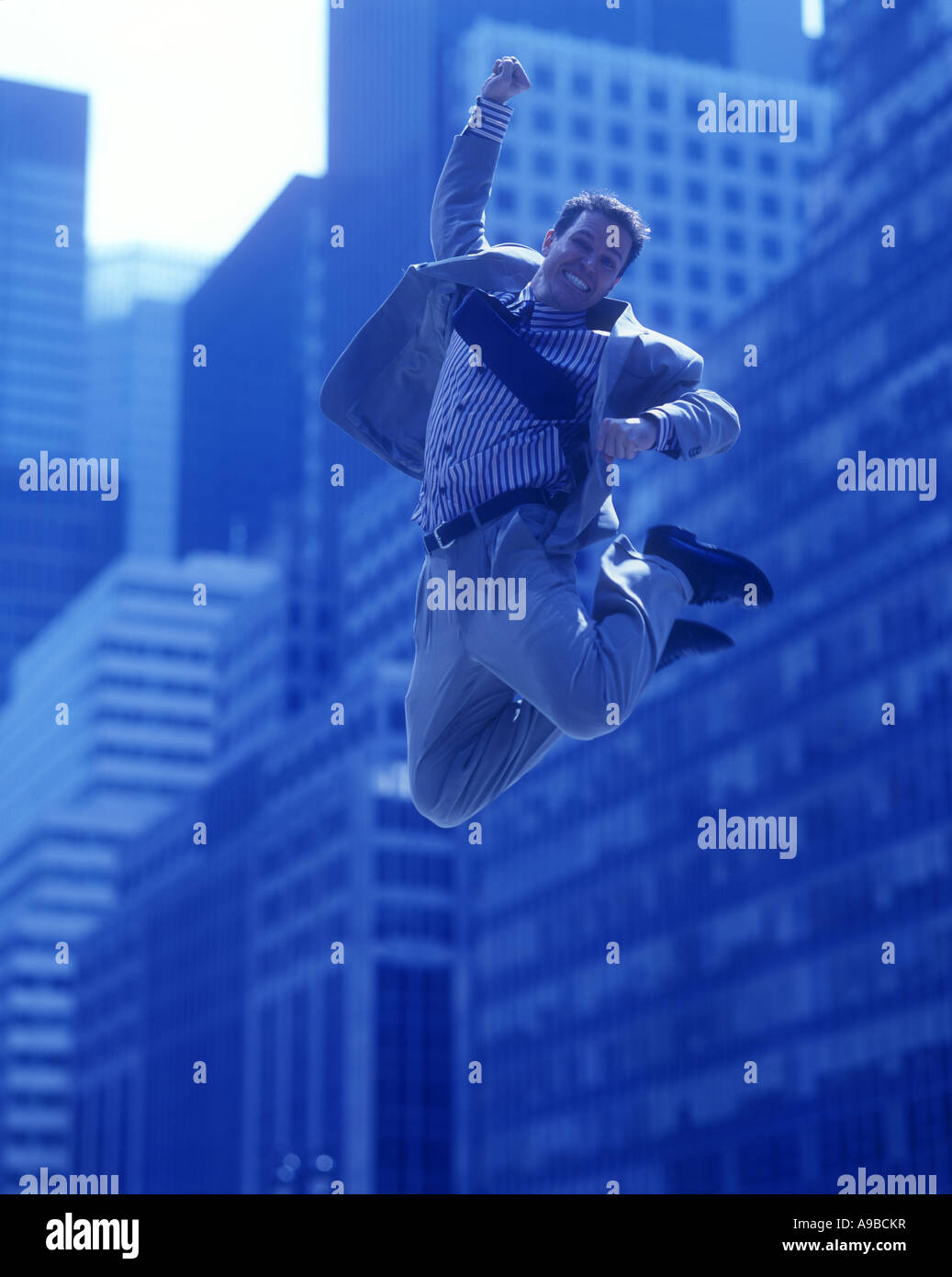 AIRBORNE OFFICE WORKER JUMPING IN MID AIR OFFICE BUILDINGS MANHATTAN ...