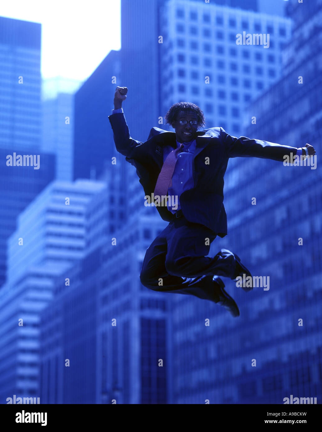 AIRBORNE OFFICE WORKER JUMPING IN MID AIR OFFICE BUILDINGS MANHATTAN ...