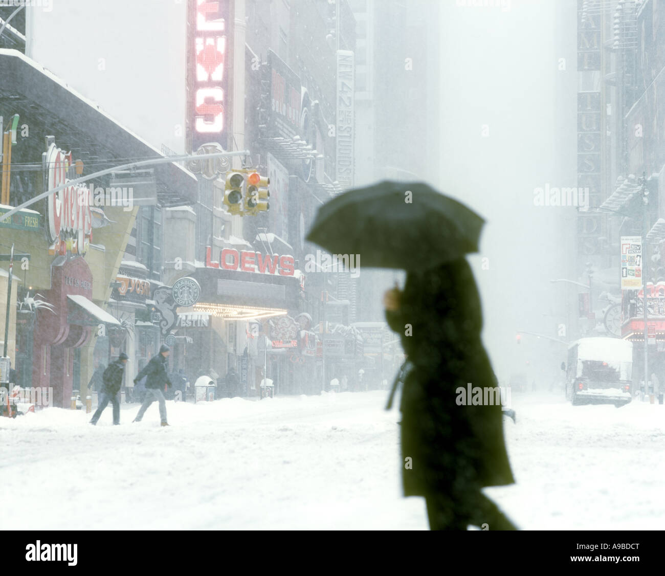 PERSON CROSSING STREET SNOW COVERED BLIZZARD FORTY SECOND STREET ...