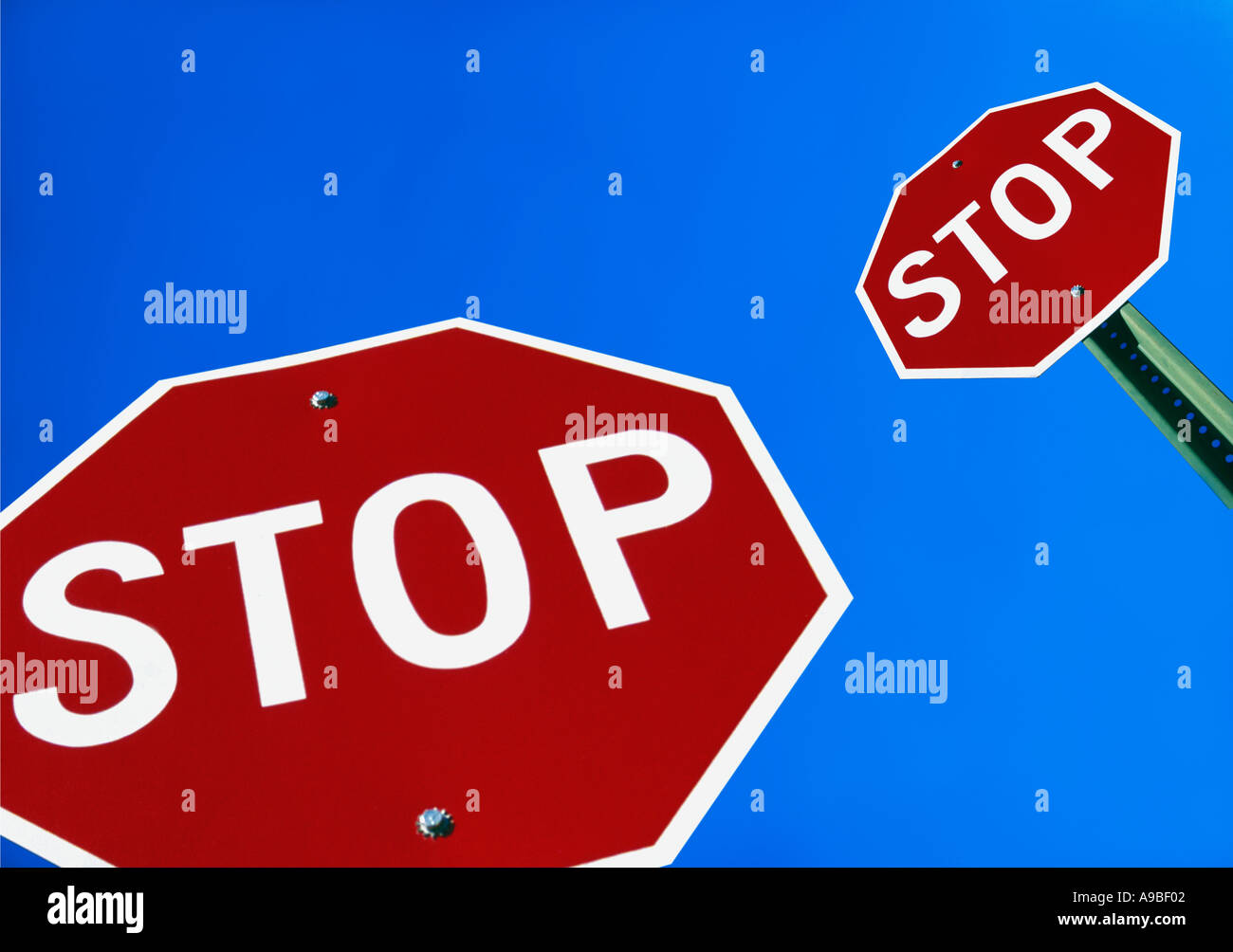 Two Stop Road signs Stock Photo - Alamy