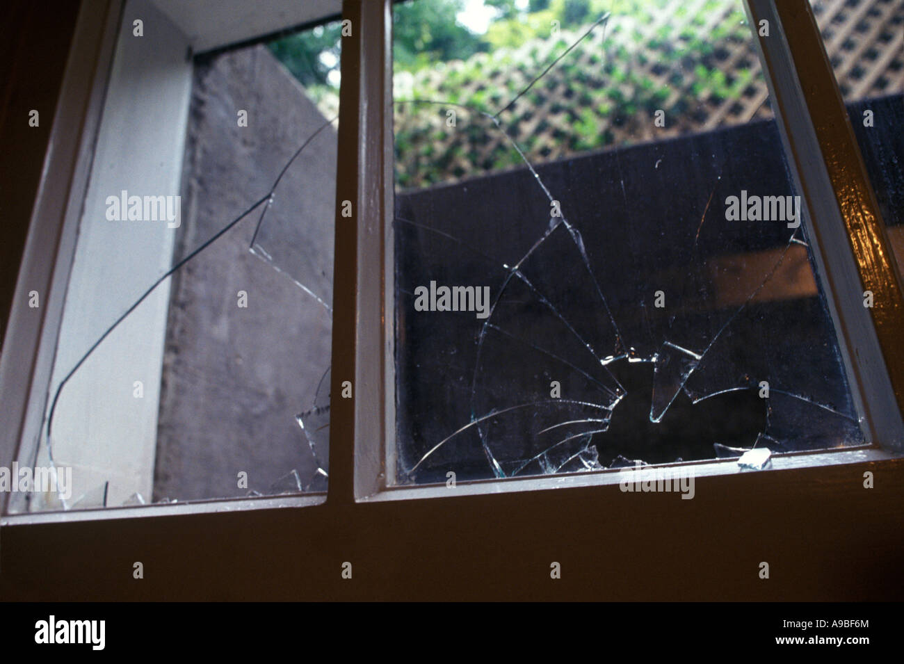 BROKEN WINDOW PANES OF FRAME OF OPEN BASEMENT WINDOW Stock Photo - Alamy