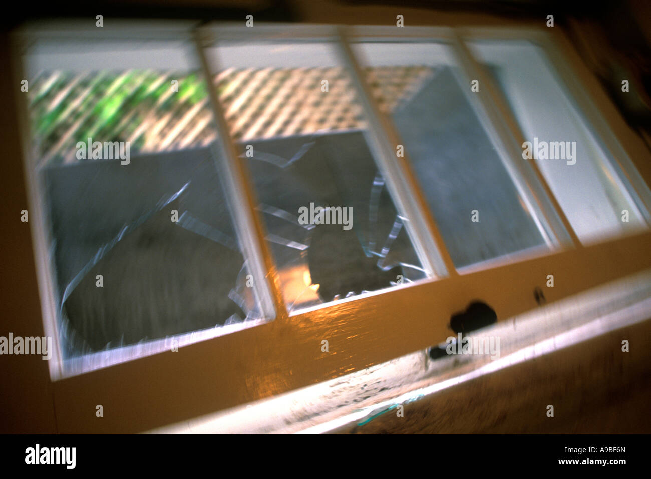 BROKEN WINDOW PANES OF FRAME OF OPEN BASEMENT WINDOW Stock Photo - Alamy