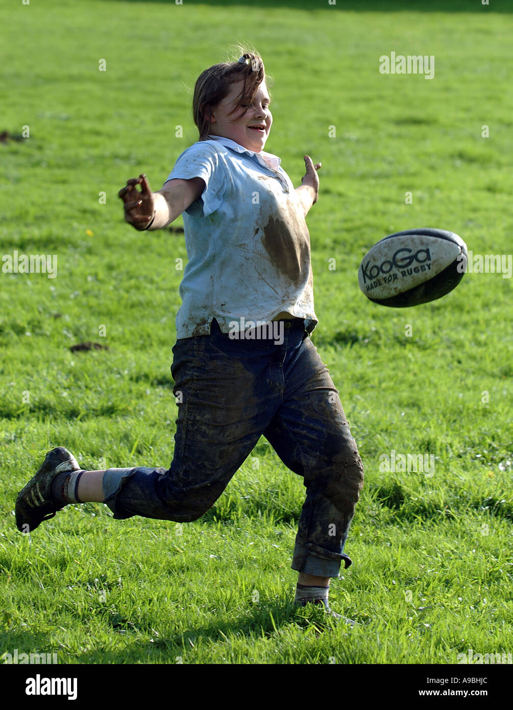 Girl playing rugby Stock Photo - Alamy