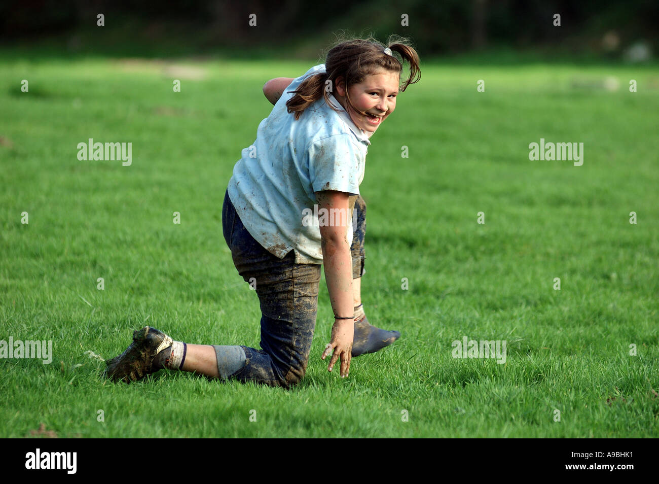 Girl playing rugby Stock Photo - Alamy