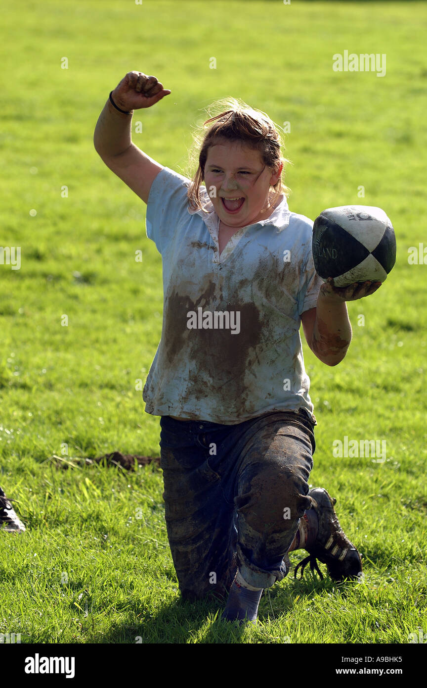 Girl playing rugby Stock Photo - Alamy