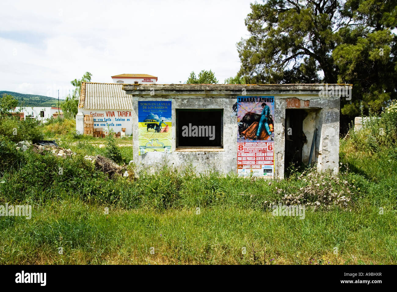old farm building near Bolonia Andalucia Spain covered in posters ...