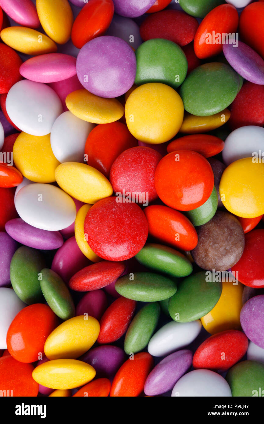 Close up background of multi colored smarties candy Stock Photo - Alamy