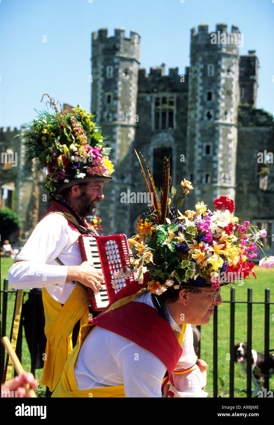 Traditional Morris Dancers band performing infront of Cowdray Castle ...