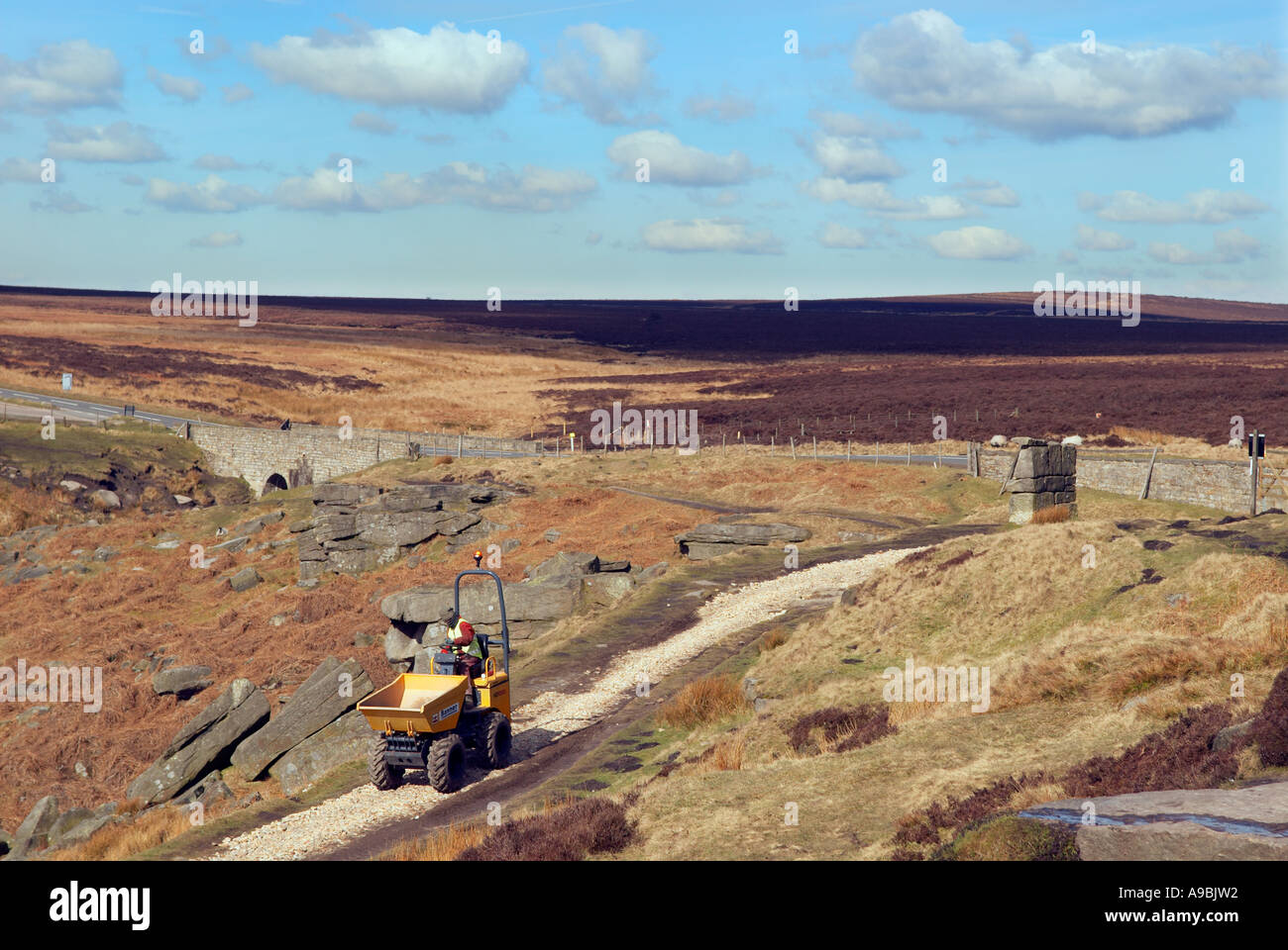 Dumper truck and driver repairing the footpath at "Upper Burbage Bridge ...