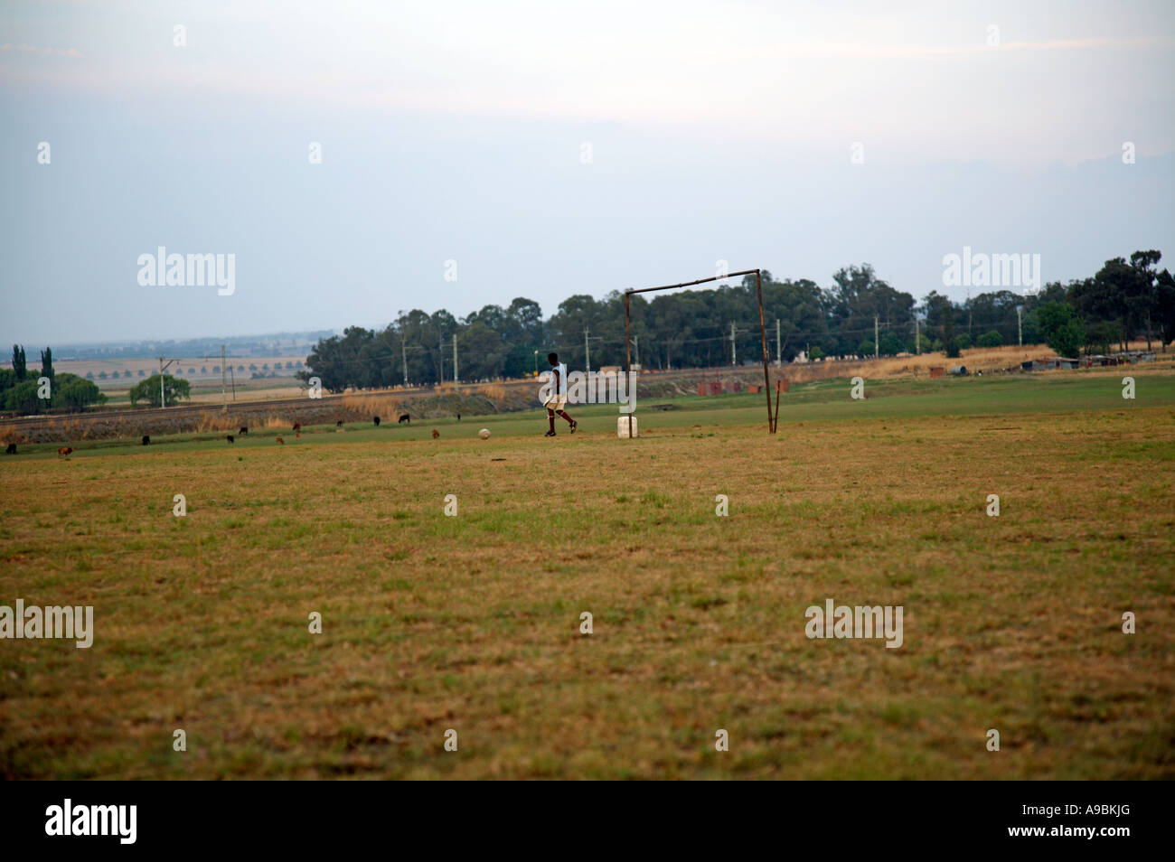 Rural African child playing soccer Stock Photo - Alamy
