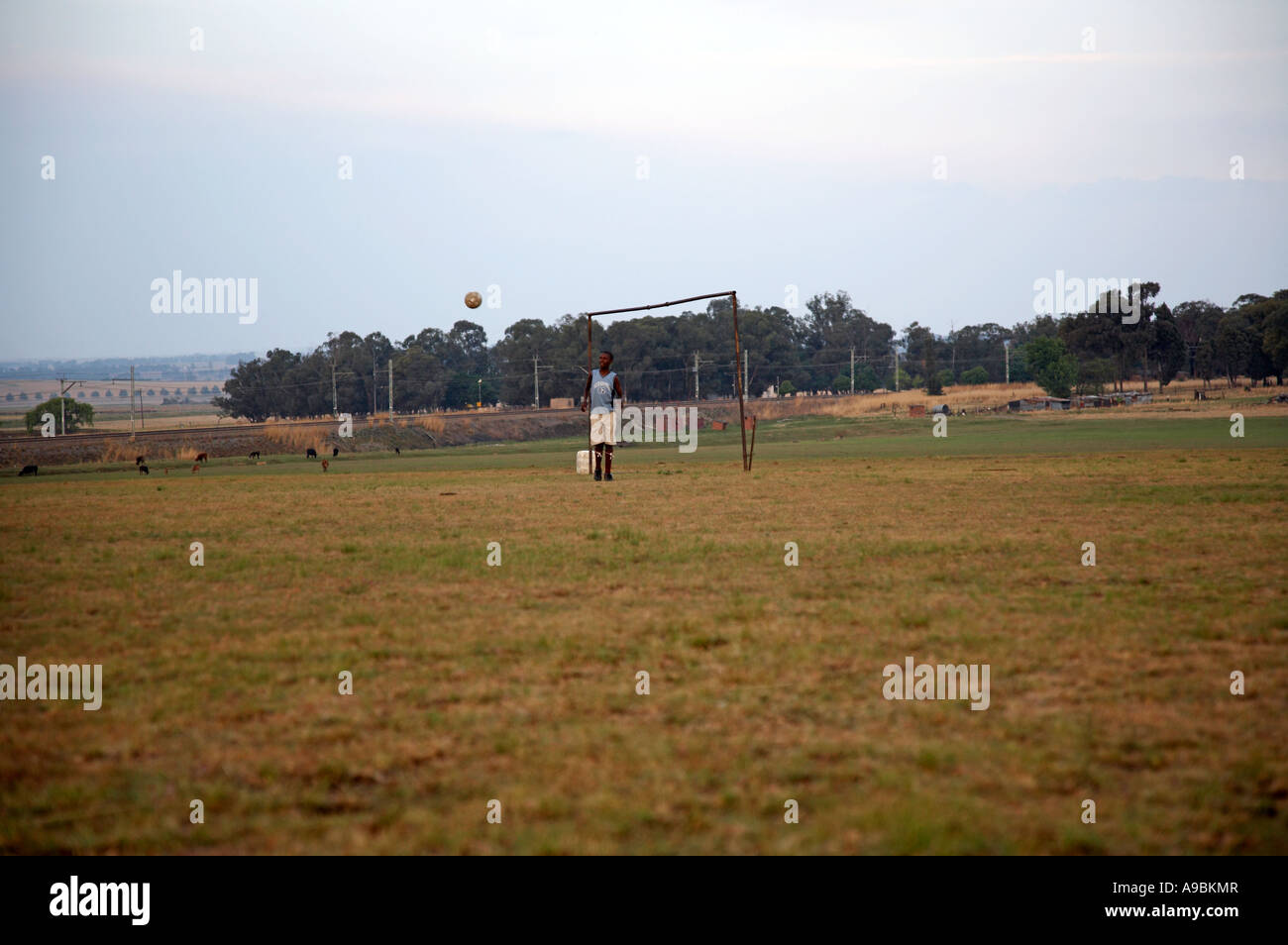 Rural African child playing soccer Stock Photo - Alamy