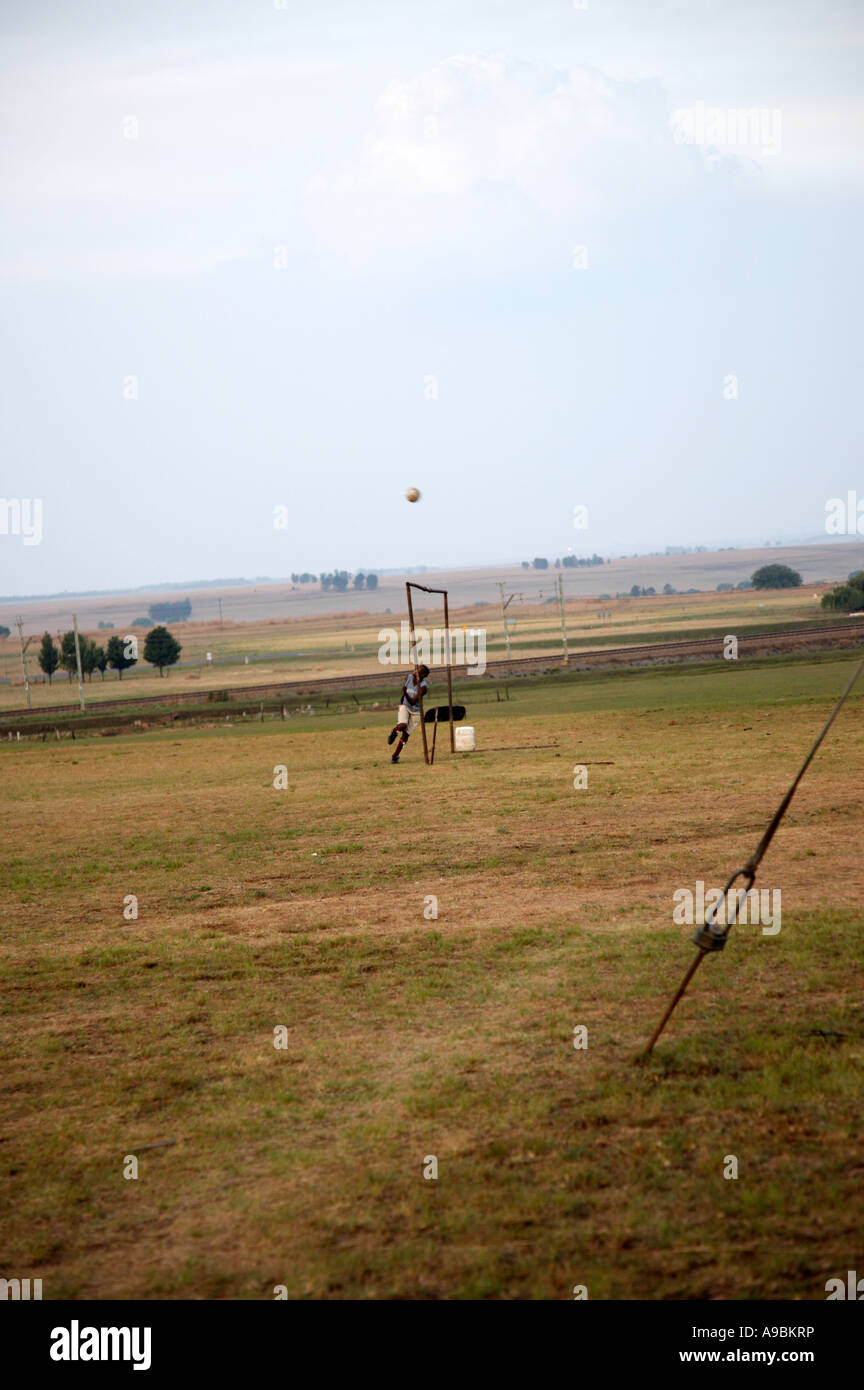 Rural African child playing soccer Stock Photo - Alamy