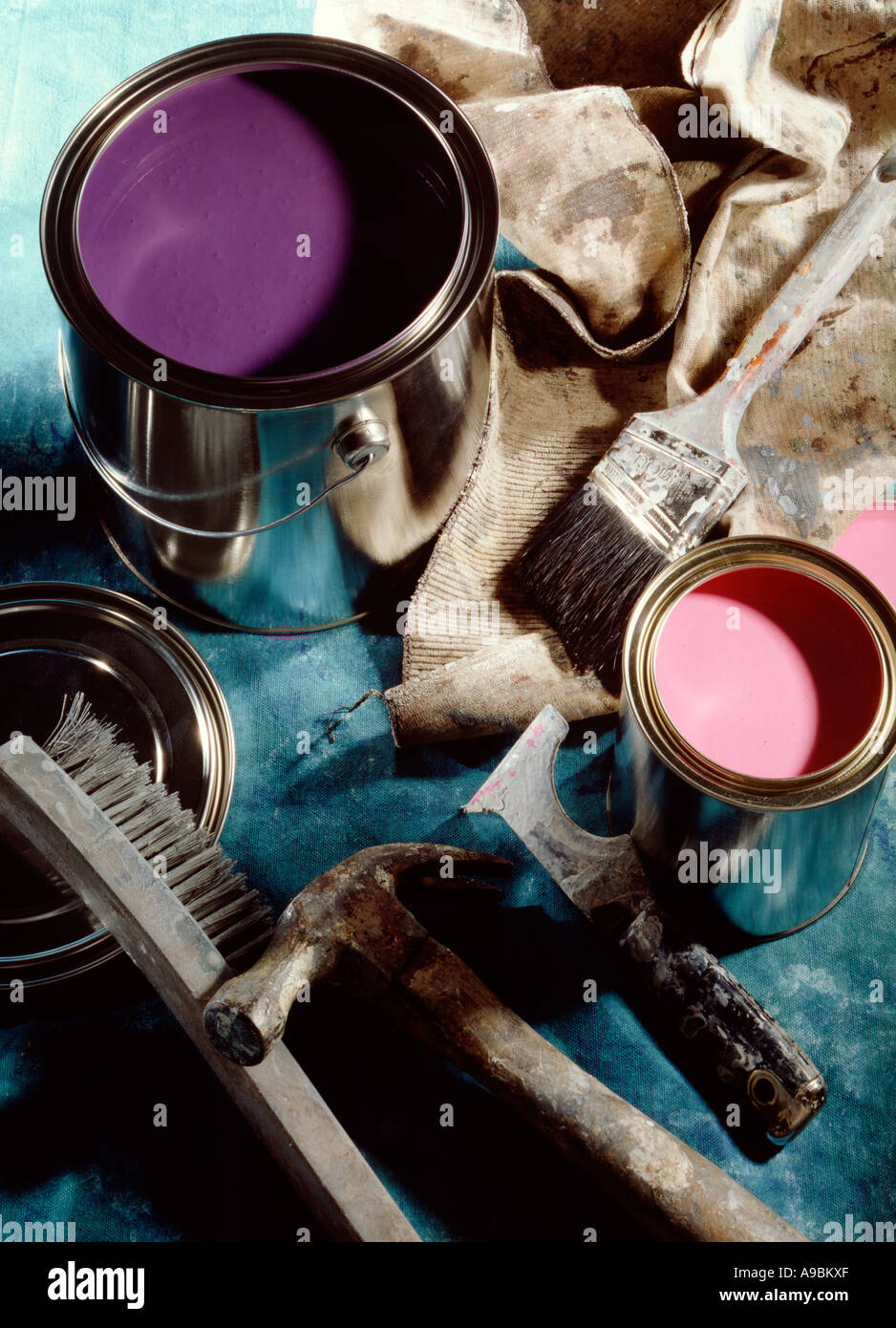 Cans of paint, brush and tools on painter's backdrop Stock Photo - Alamy
